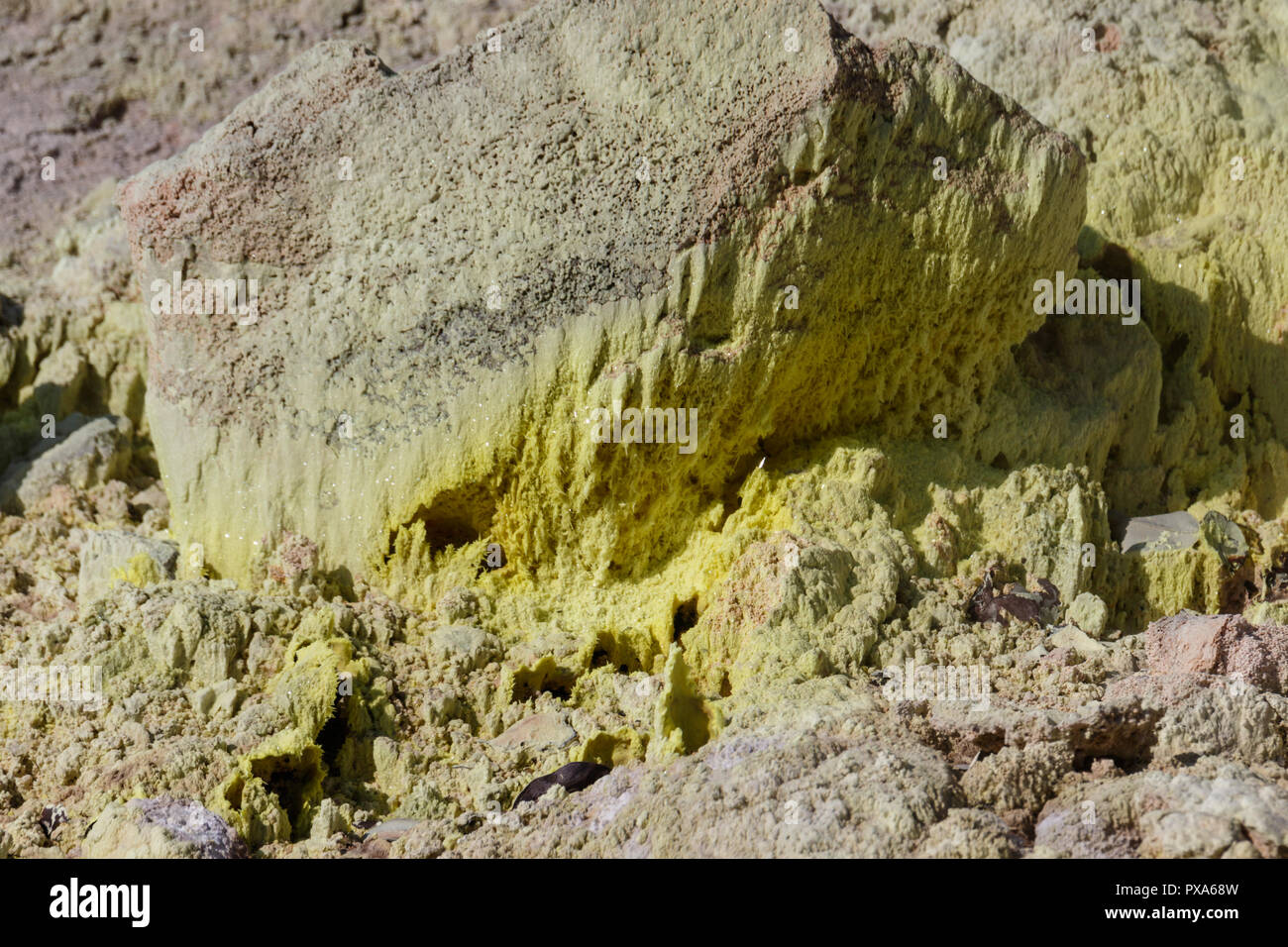 Rock above a volcanic gas vent showing sulfur deposit with visible ...