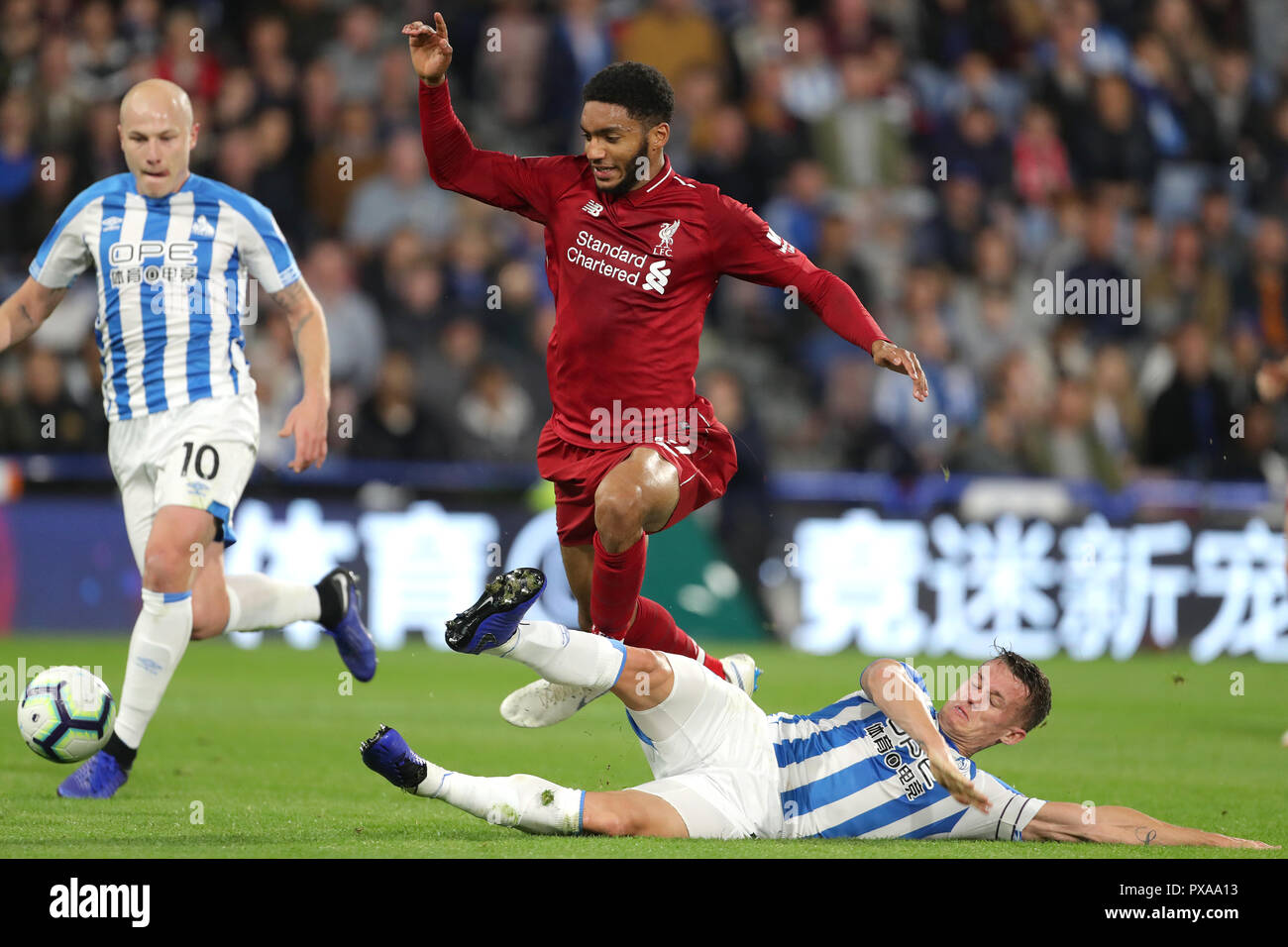 Liverpool's Joe Gomez (centre) and Huddersfield Town's Jonathan Hogg ...