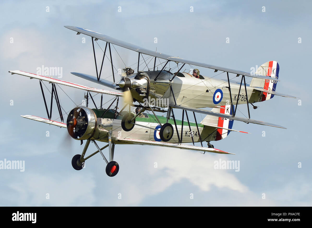 Hawker Tomtit and Avro Tutor biplanes flying at an airshow. Biplane ...