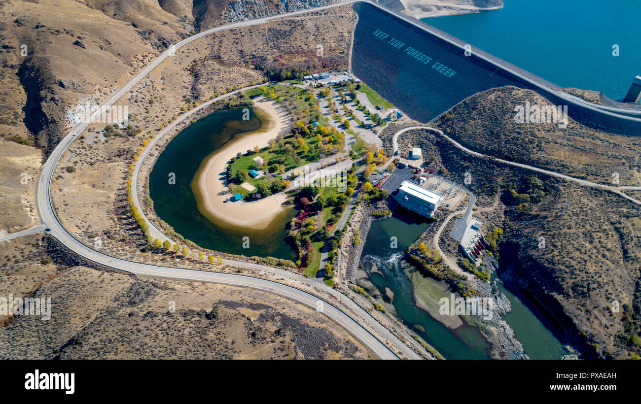 Public park at the base of a hydroelectric dam in the fall Stock Photo ...