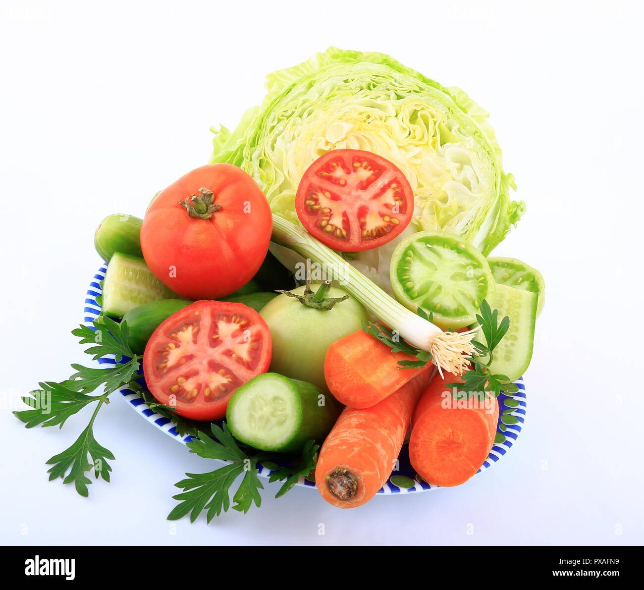 View of a composition of fresh summer vegetables on white ground Stock ...