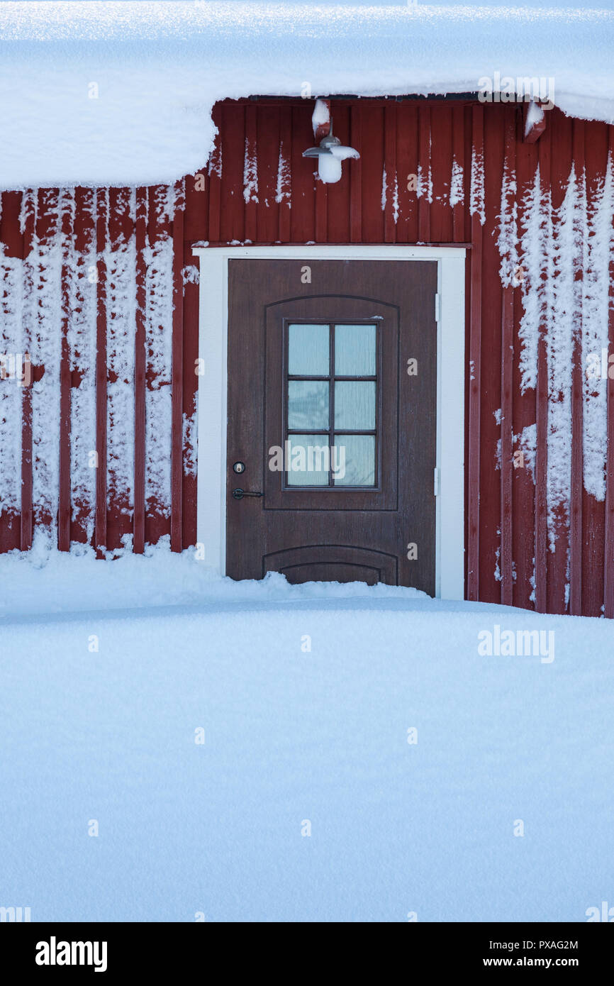 Snow covered door in the house Stock Photo - Alamy
