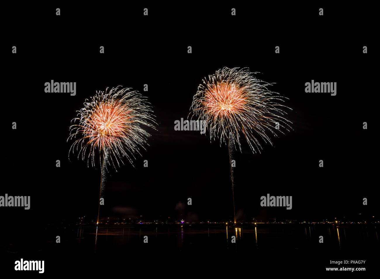 Giant explosions of fireworks rockets in the night Stock Photo - Alamy