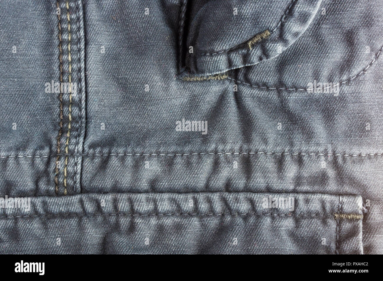 clothing items washed cotton fabric texture with seams, macro, close-up ...
