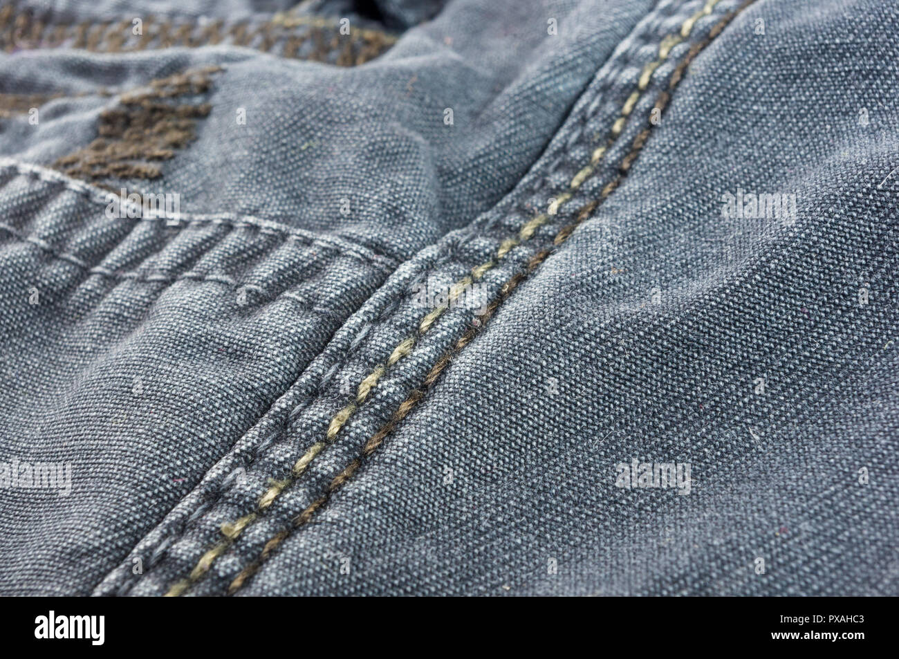 clothing items washed cotton fabric texture with seams, macro, close-up ...