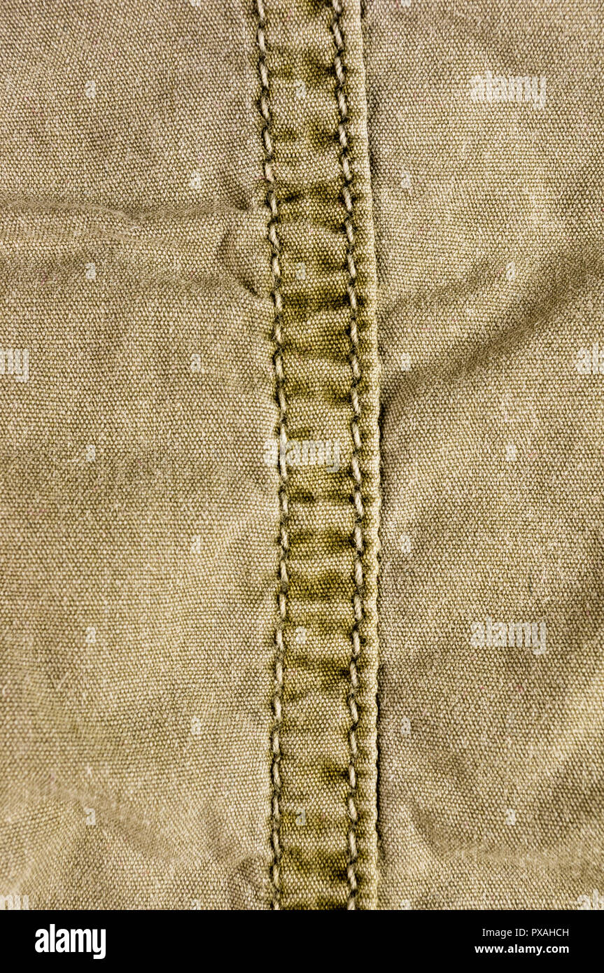 clothing items washed cotton fabric texture with seams, macro, close-up ...