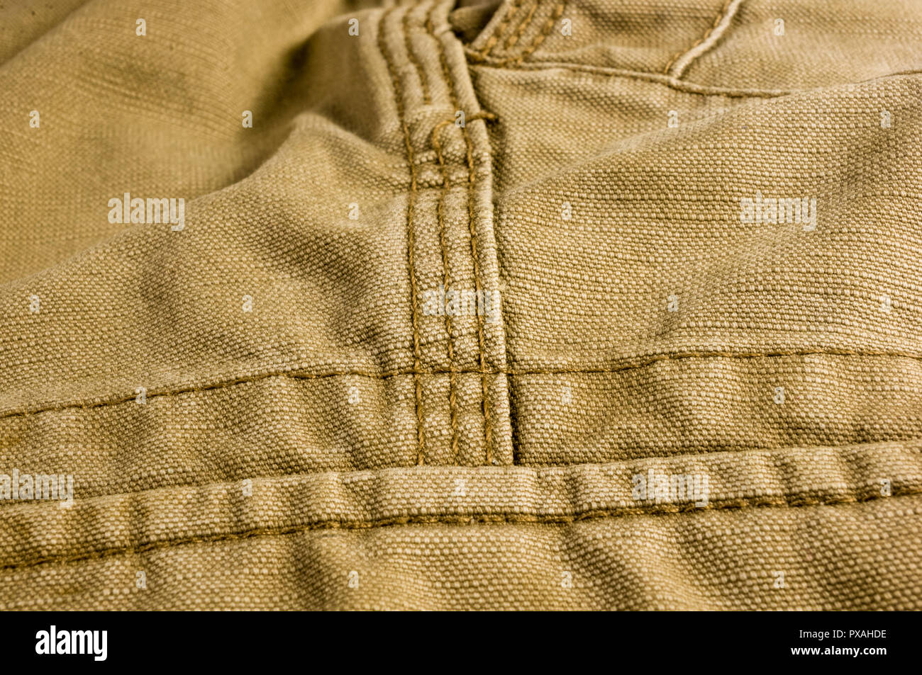 clothing items washed cotton fabric texture with seams, macro, close-up ...