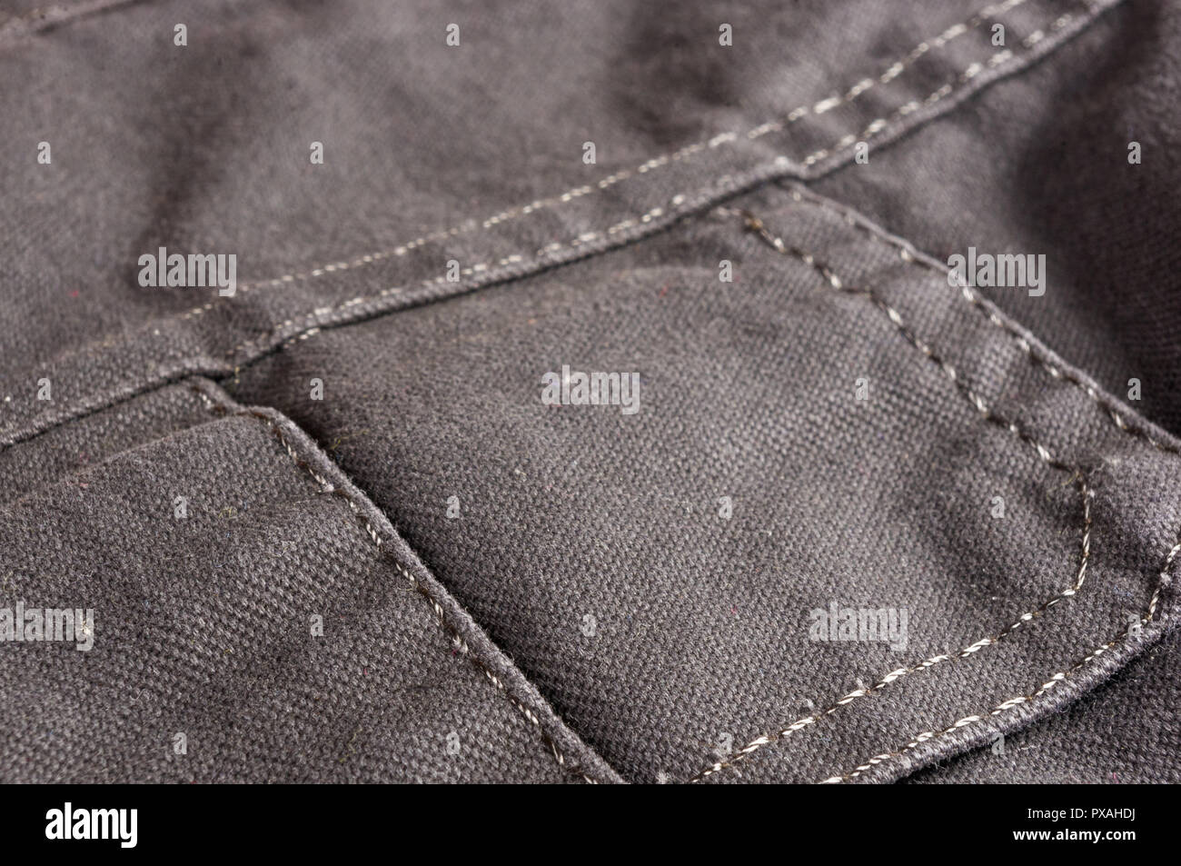 clothing items washed cotton fabric texture with seams, macro, close-up ...