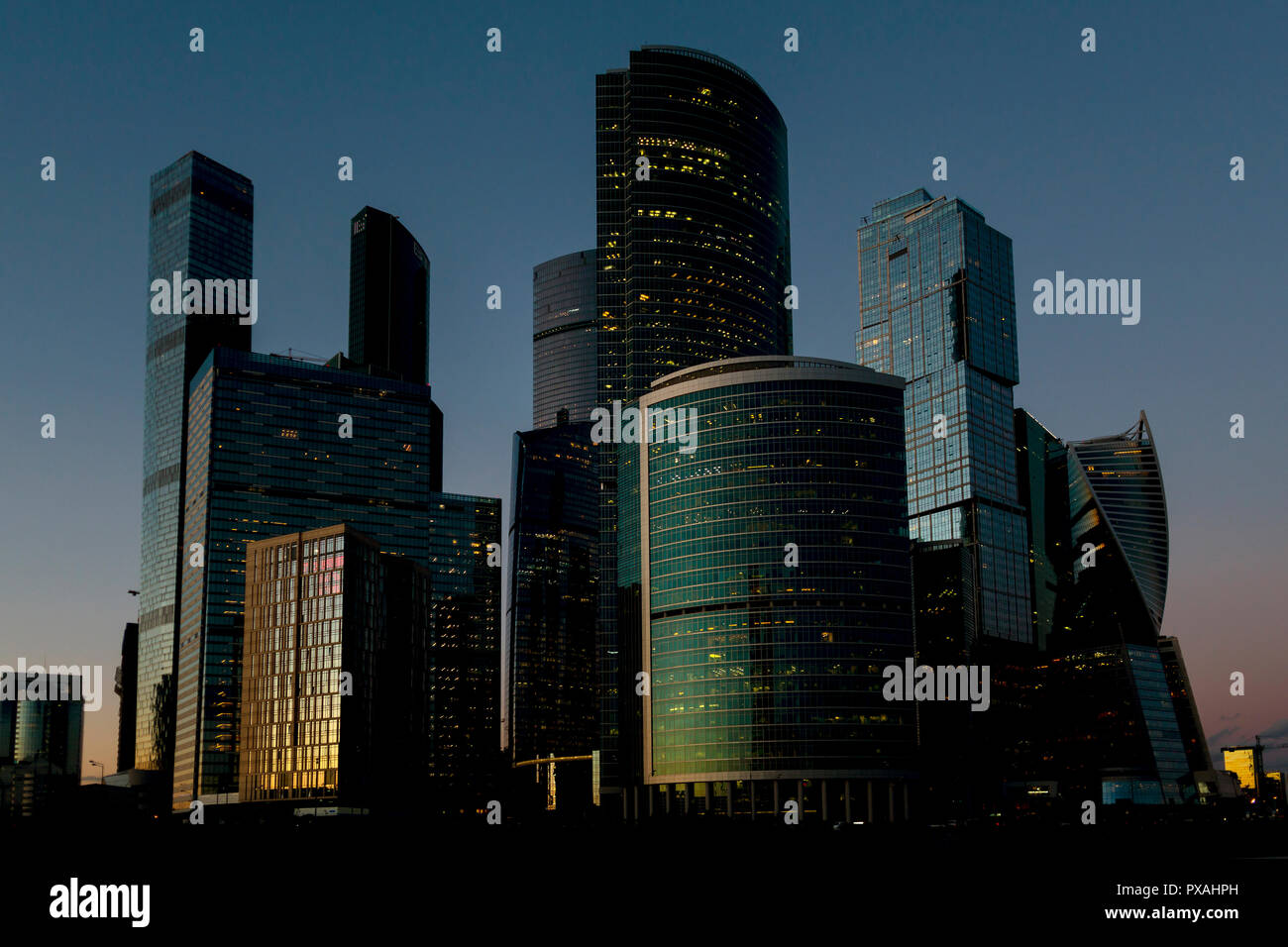 Skyscrapers in the rays of sunset Stock Photo - Alamy