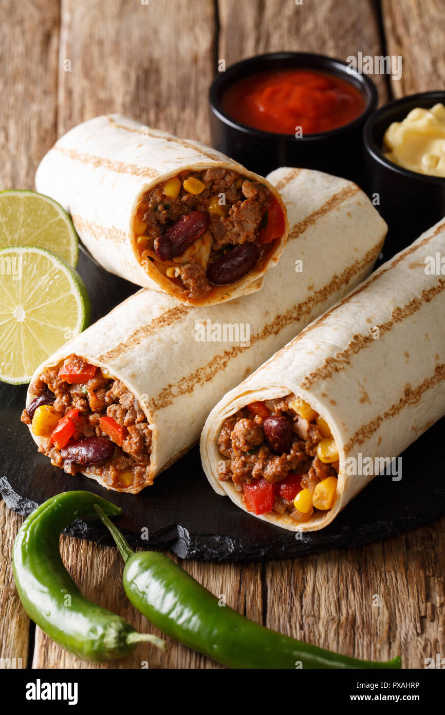 Mexican grilled burrito with beef, beans, corn, pepper and tomatoes ...