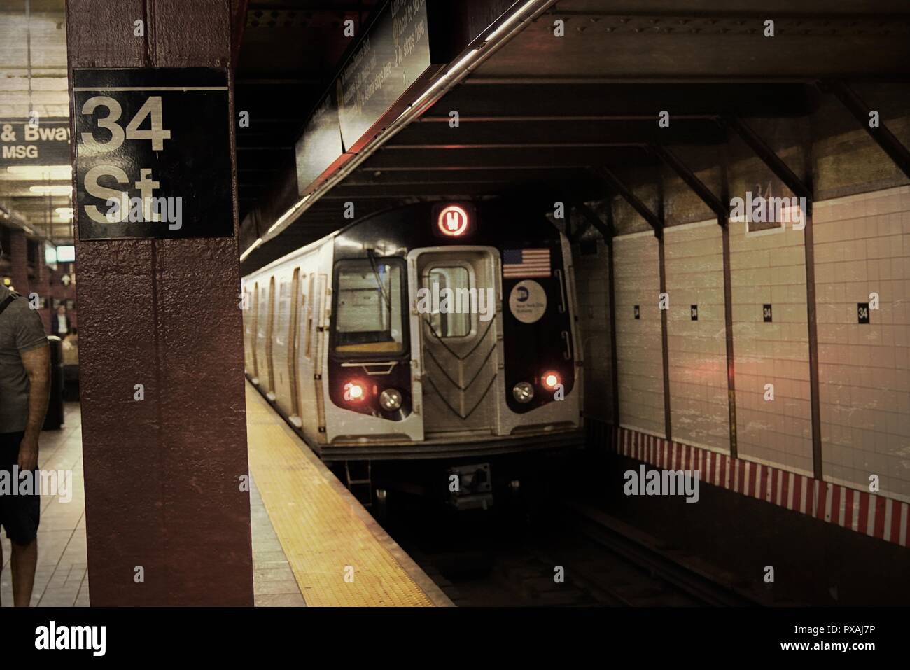 NYC Subway Trains approaching and leaving a subway station Stock Photo ...