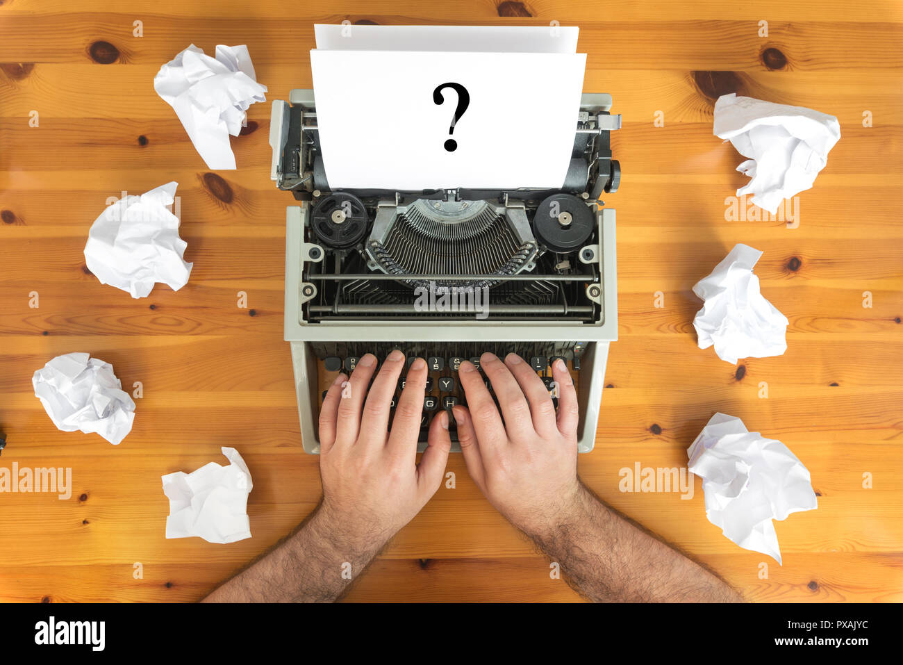 Writer's block. Typewriter and crumpled paper on work desk. Creative ...