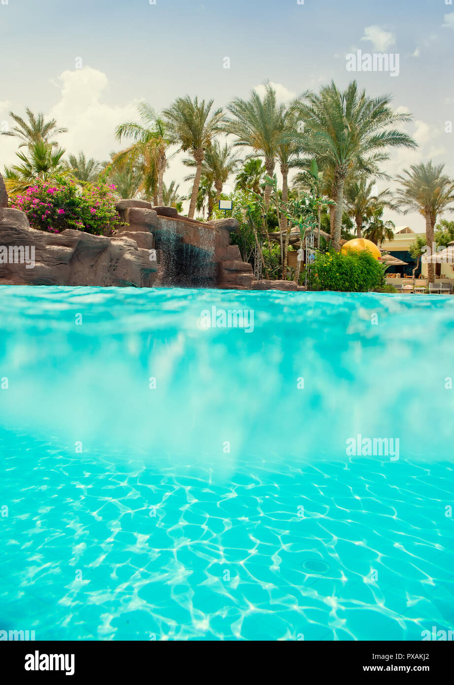 swimming pool with waterfall Stock Photo - Alamy