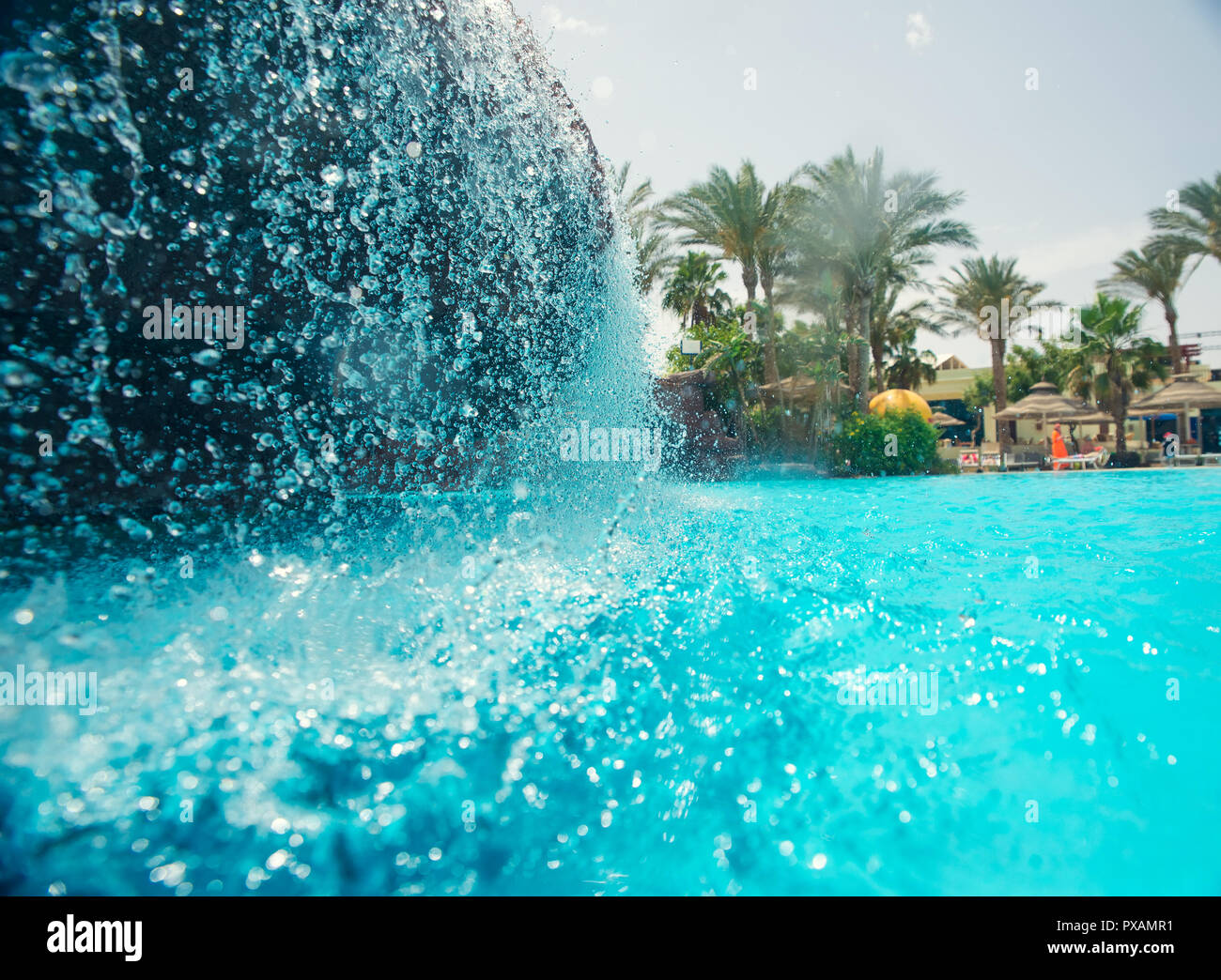 swimming pool with waterfall Stock Photo - Alamy
