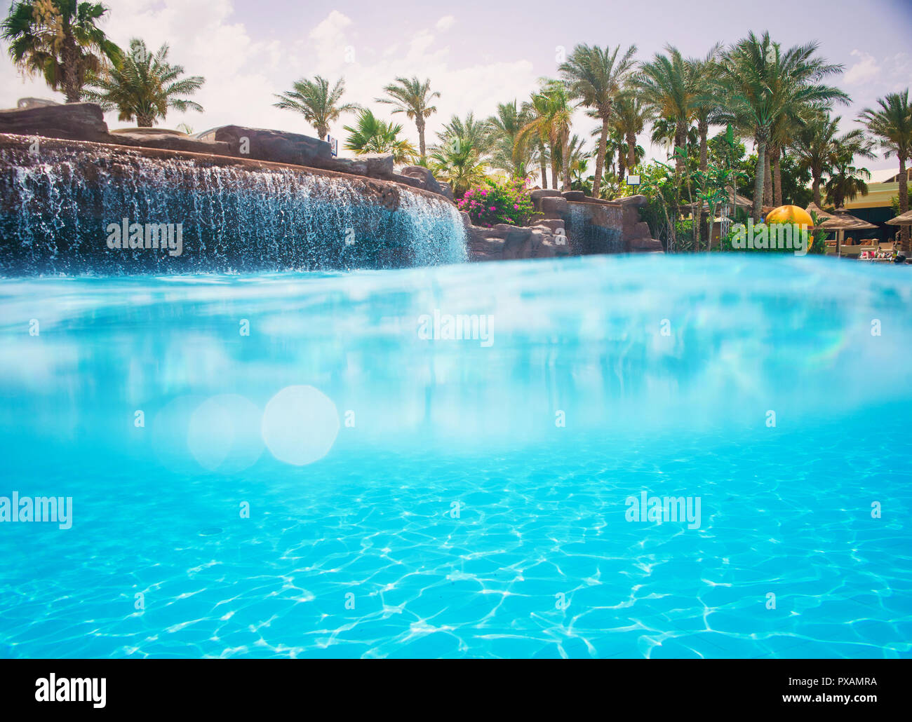swimming pool with waterfall Stock Photo - Alamy