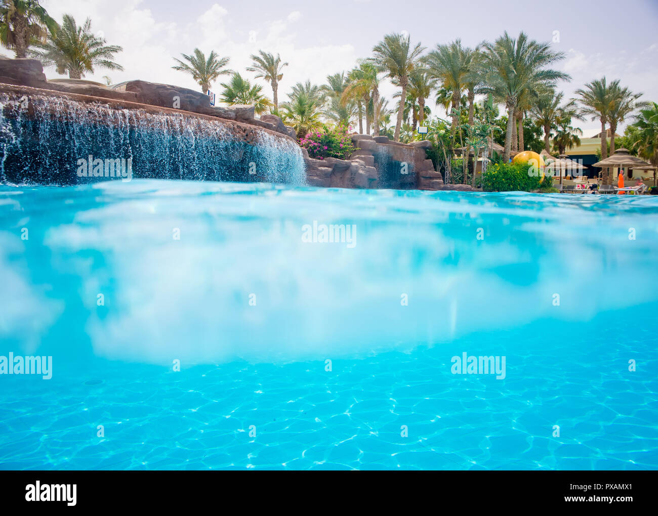 swimming pool with waterfall Stock Photo - Alamy