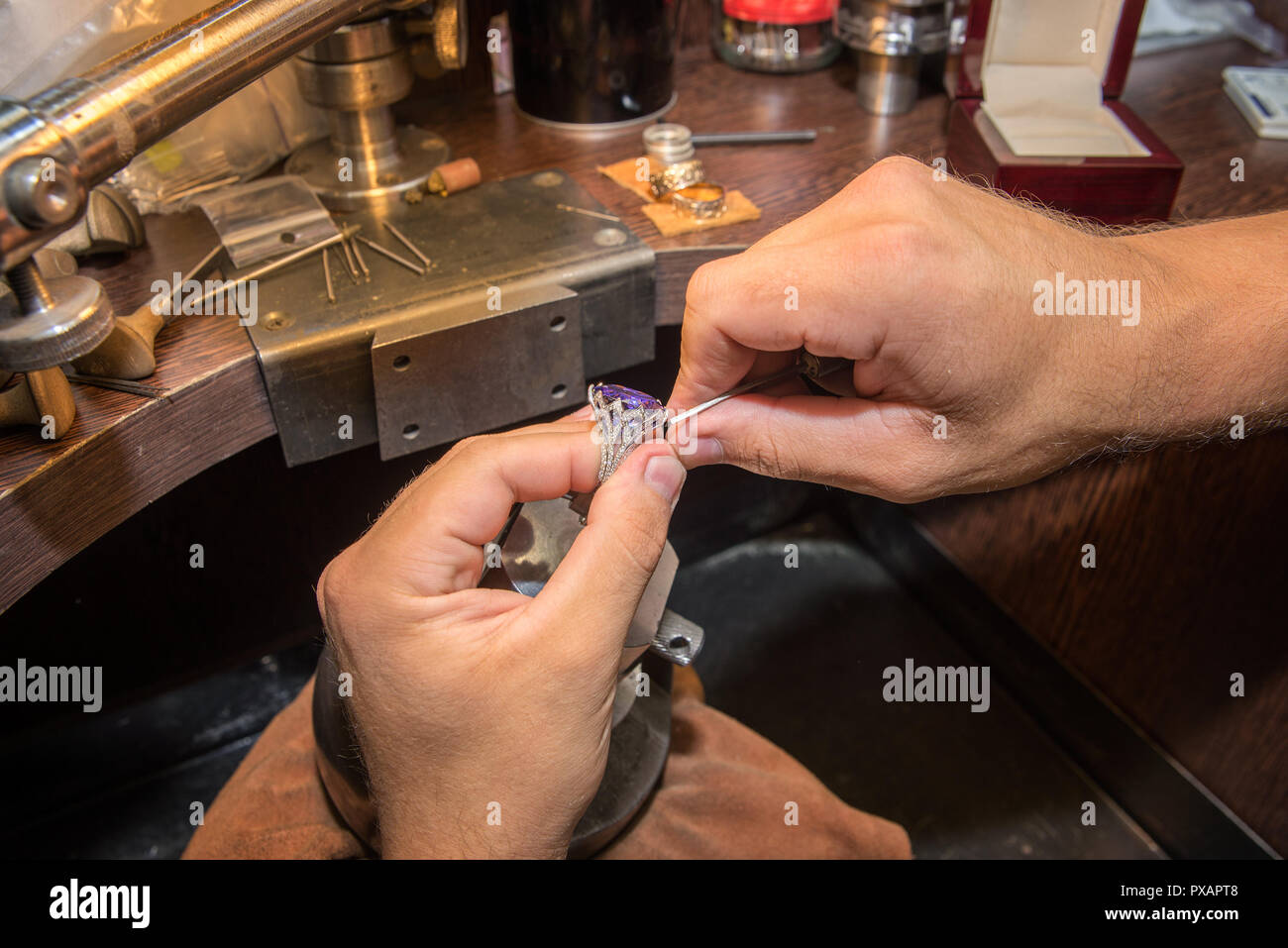 Master jeweler produces a gold ring Stock Photo - Alamy