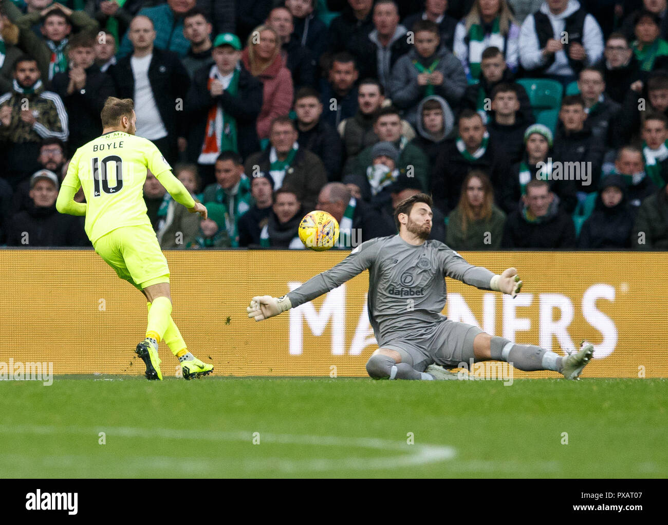 Martin Boyle of Hibs scores past Celtic goalkeeper Craig Gordon during ...