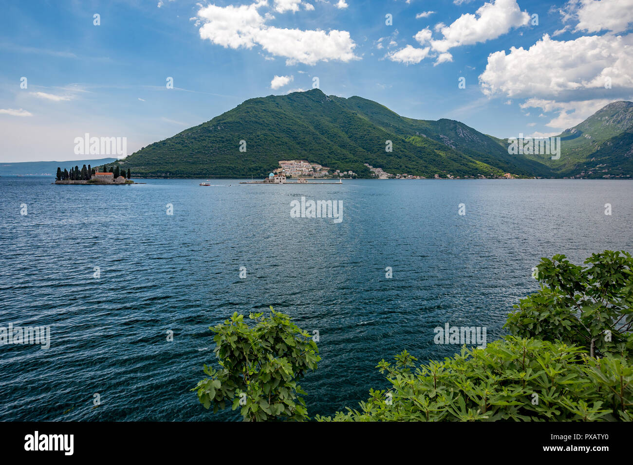 Sunny spring daytime view towards the two islets of Sv. Djordje, left ...