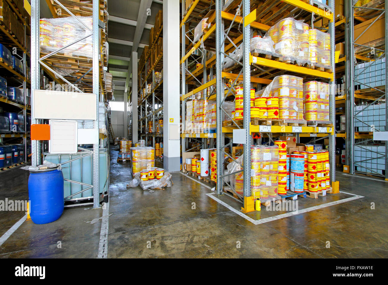 Warehouse with flammable liquids in cans and barrels Stock Photo - Alamy