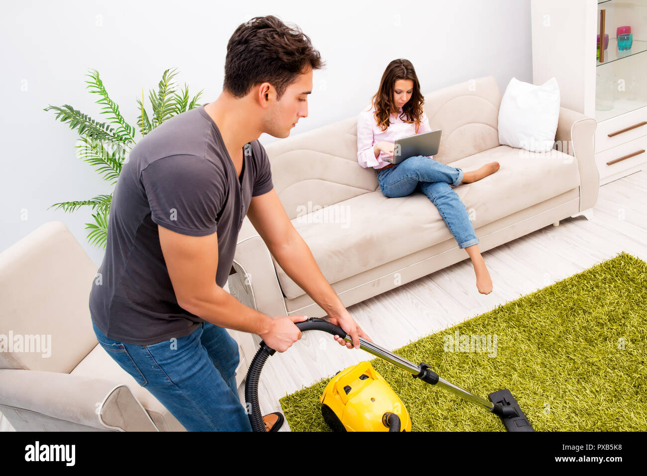 Cleaning the house with vacuum cleaner Stock Photo - Alamy