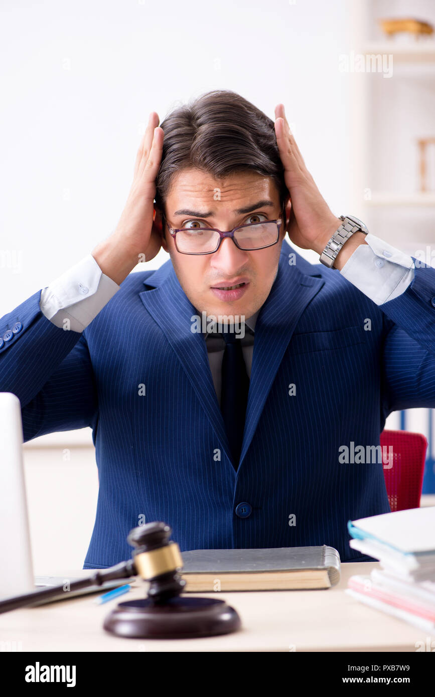 Young handsome judge working in court Stock Photo - Alamy