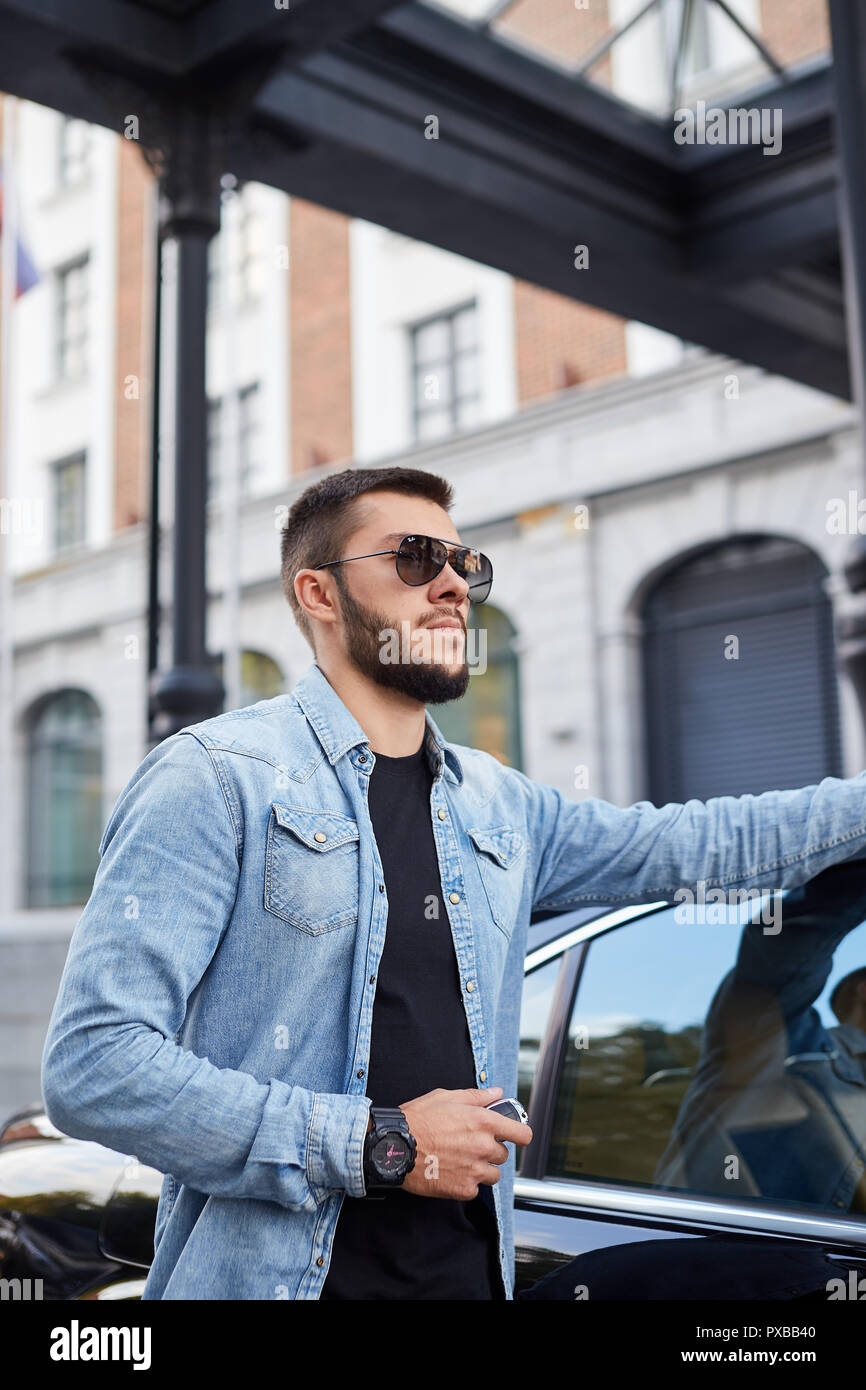 young ambitious man advertising a new model of the car Stock Photo - Alamy