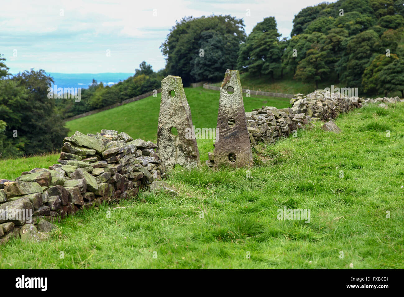 Unusual stone gate posts with holes in them near Rainow, Cheshire ...