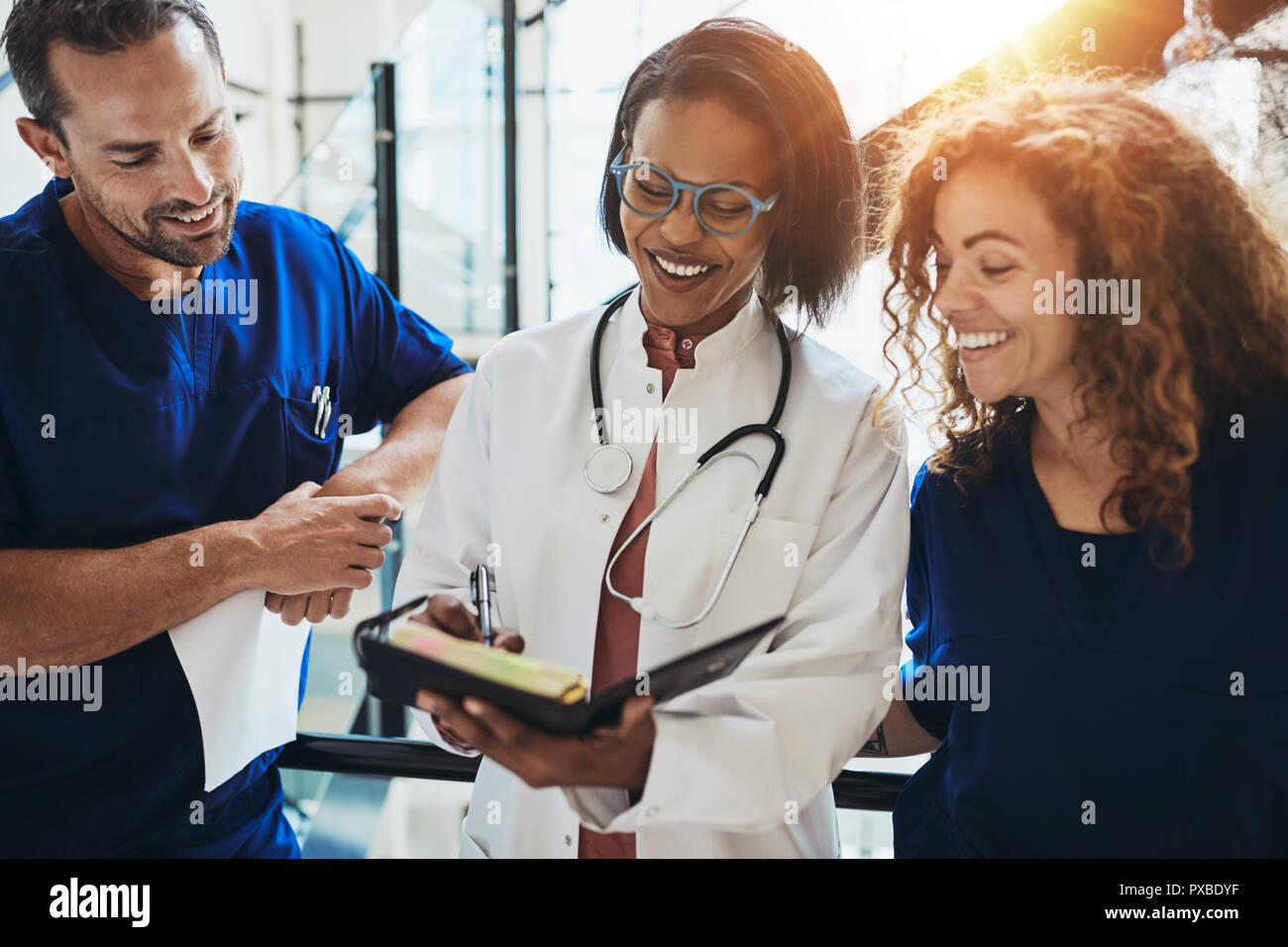 Female medical intern discussing patients hi-res stock photography and ...