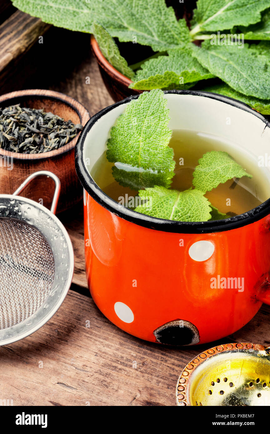 Brewed delicious herbal tea with sage on retro background Stock Photo ...