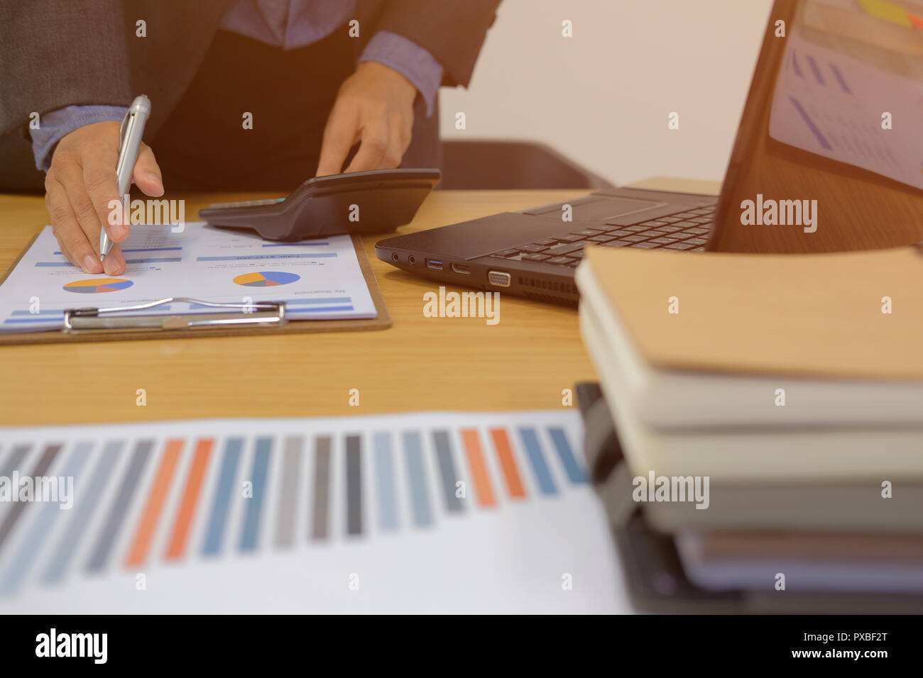 financial adviser working with calculator, business document at office ...