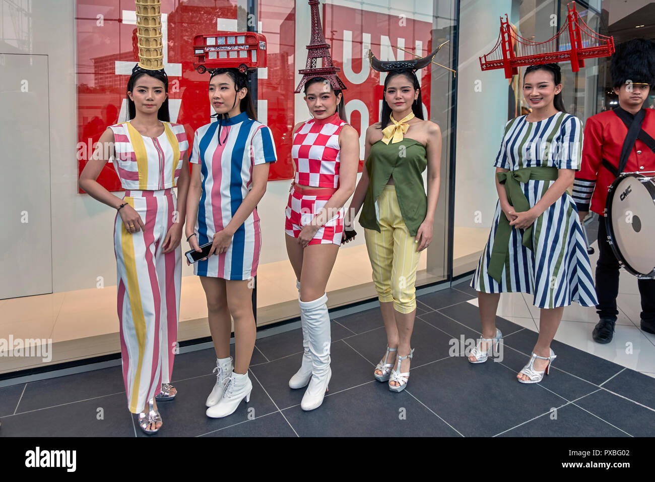 Promotion girls. Models greeting customers wearing travel destination ...