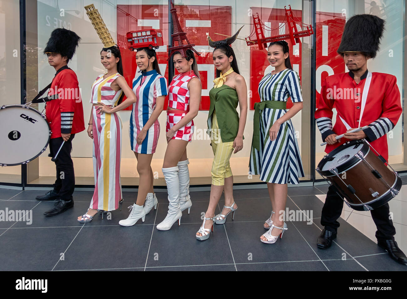 Promotion girls. Models greeting customers wearing travel destination ...