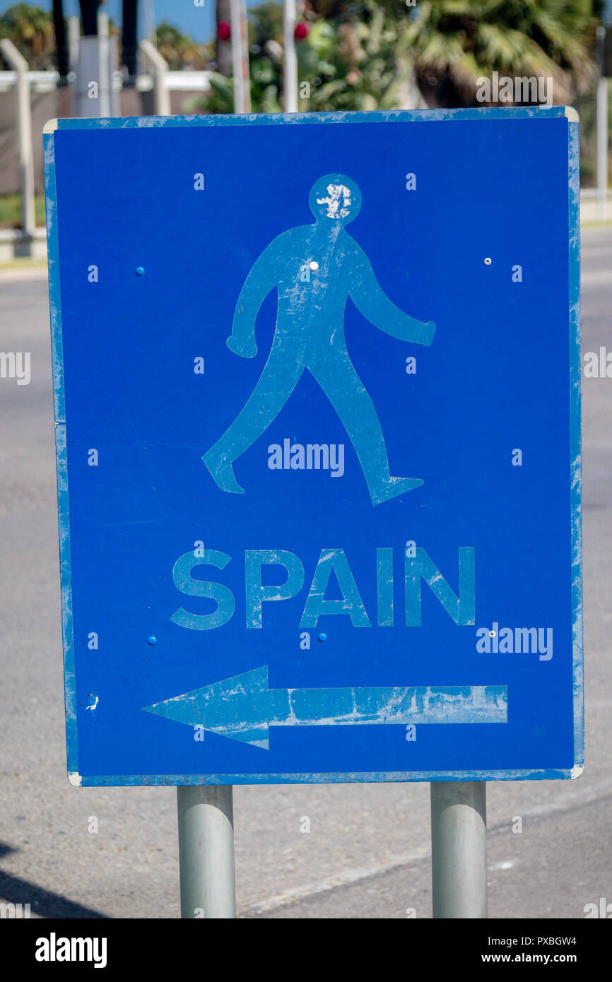 Sign pointing to Spain at the Border with Gibraltar a British overseas ...