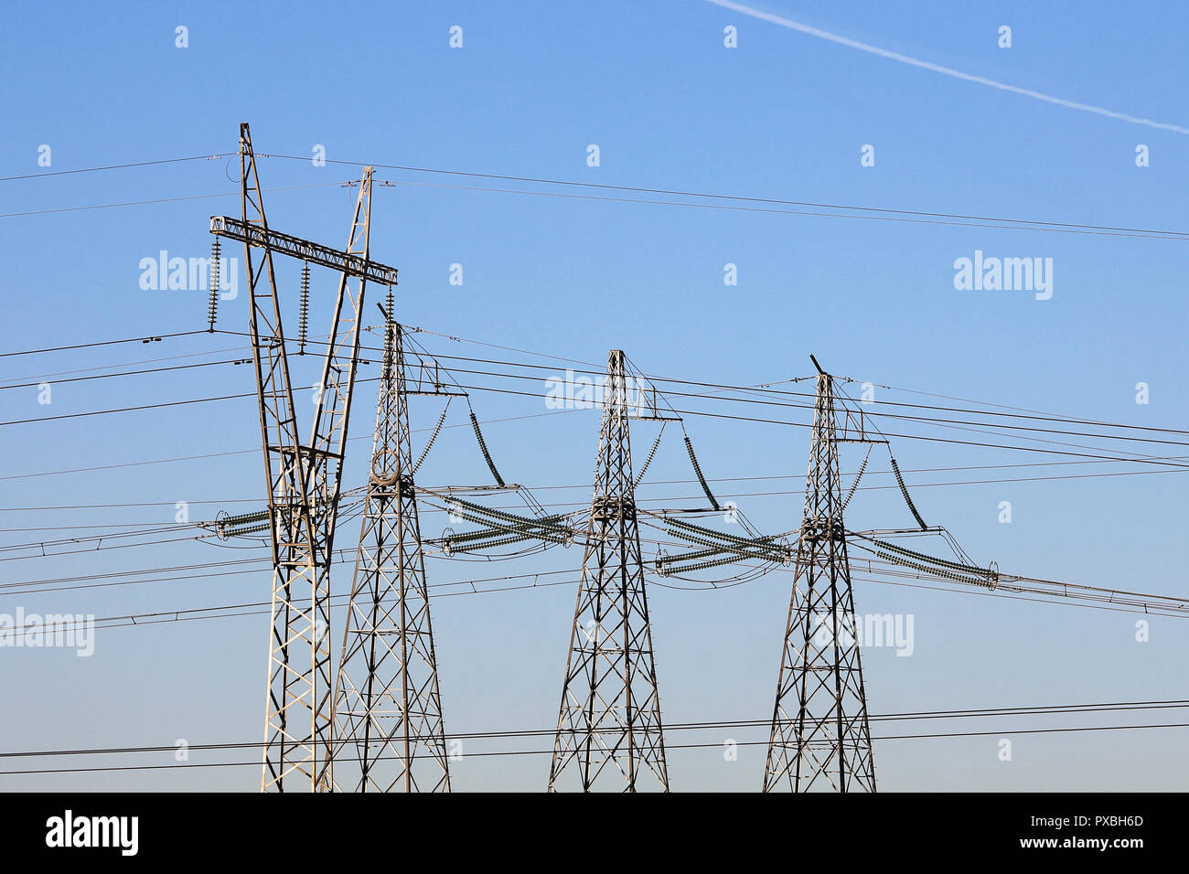 Intermediate anchor poles of power lines with high voltage wires Stock ...