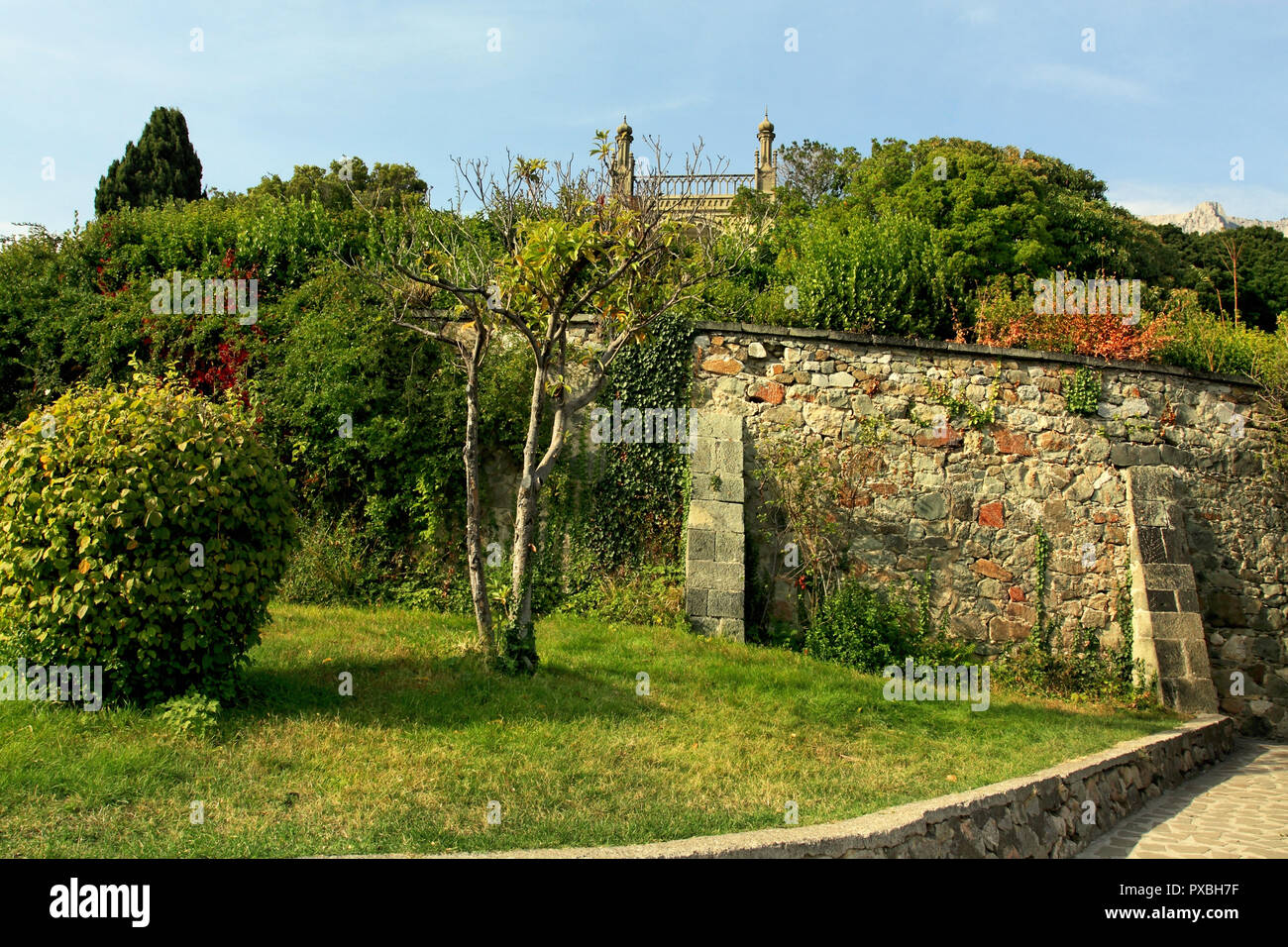 Ancient stone wall in an old time palace park Stock Photo - Alamy