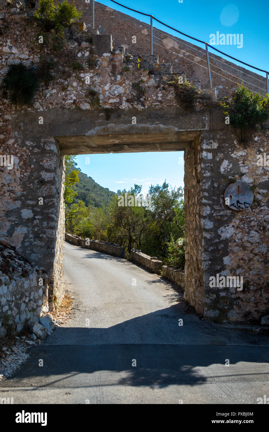 A road on the Rock of Gibraltar in the Upper Rock Nature reserve cut ...
