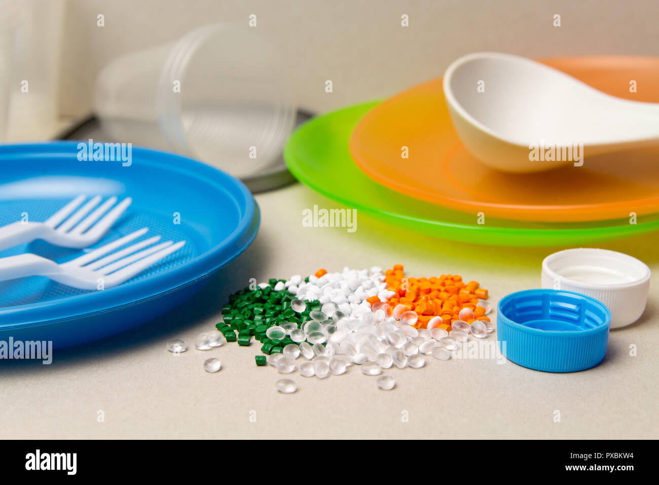 Plastic disposable tableware and Plastic Raw material. Colored granules ...