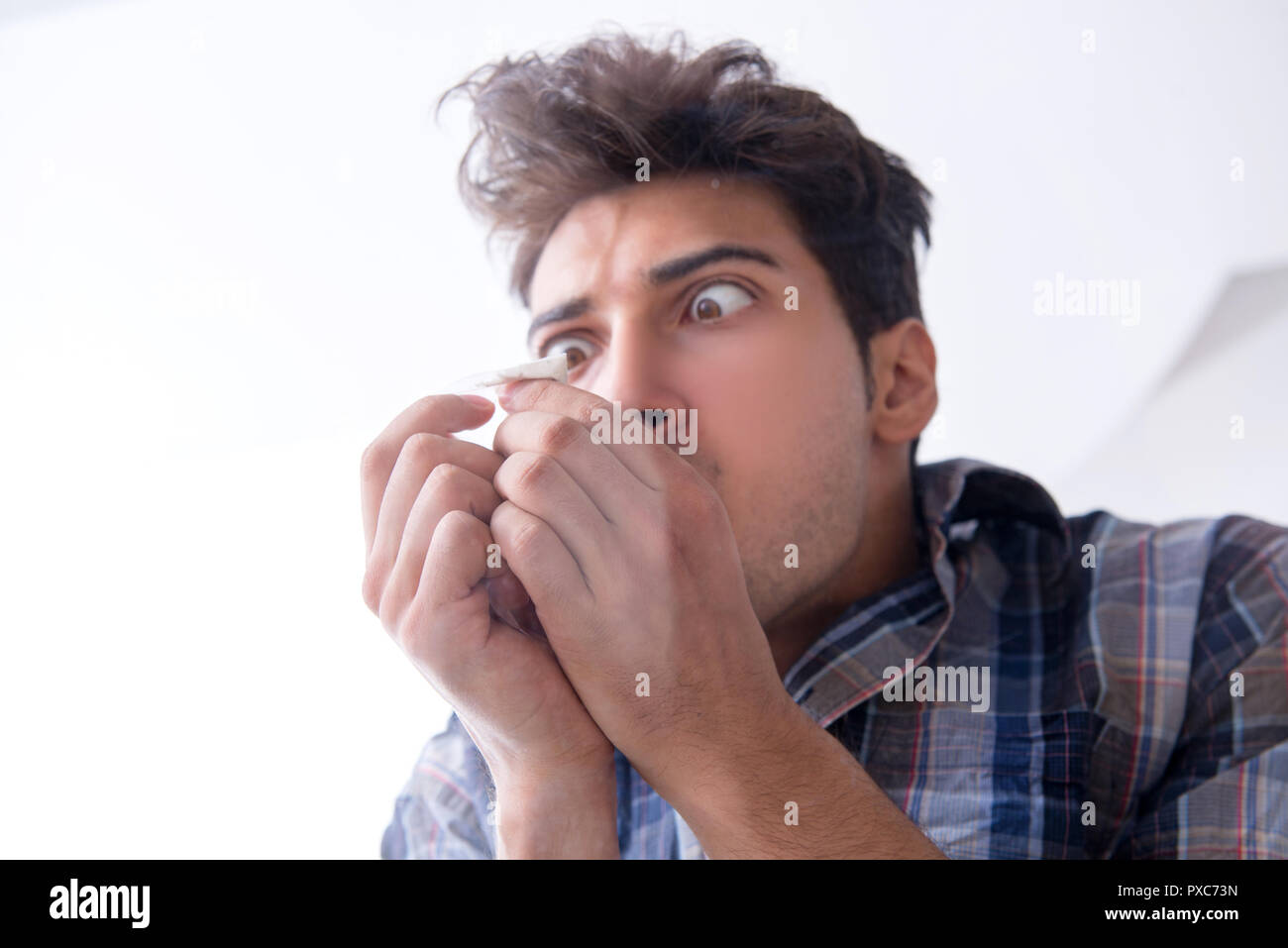 Drug addict sniffing cocaine narcotic Stock Photo - Alamy