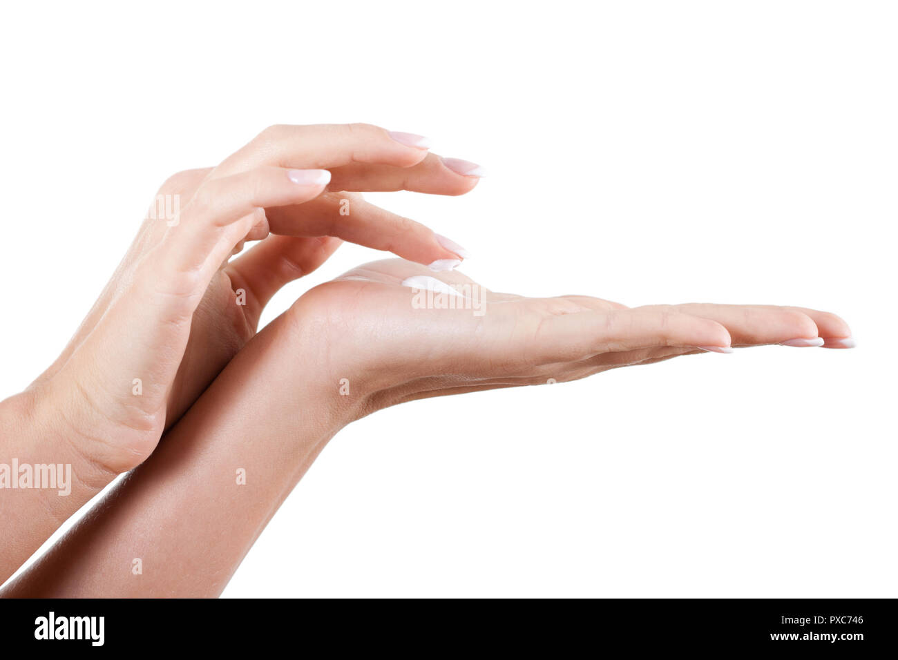 Applying moisturizer on hand Stock Photo - Alamy