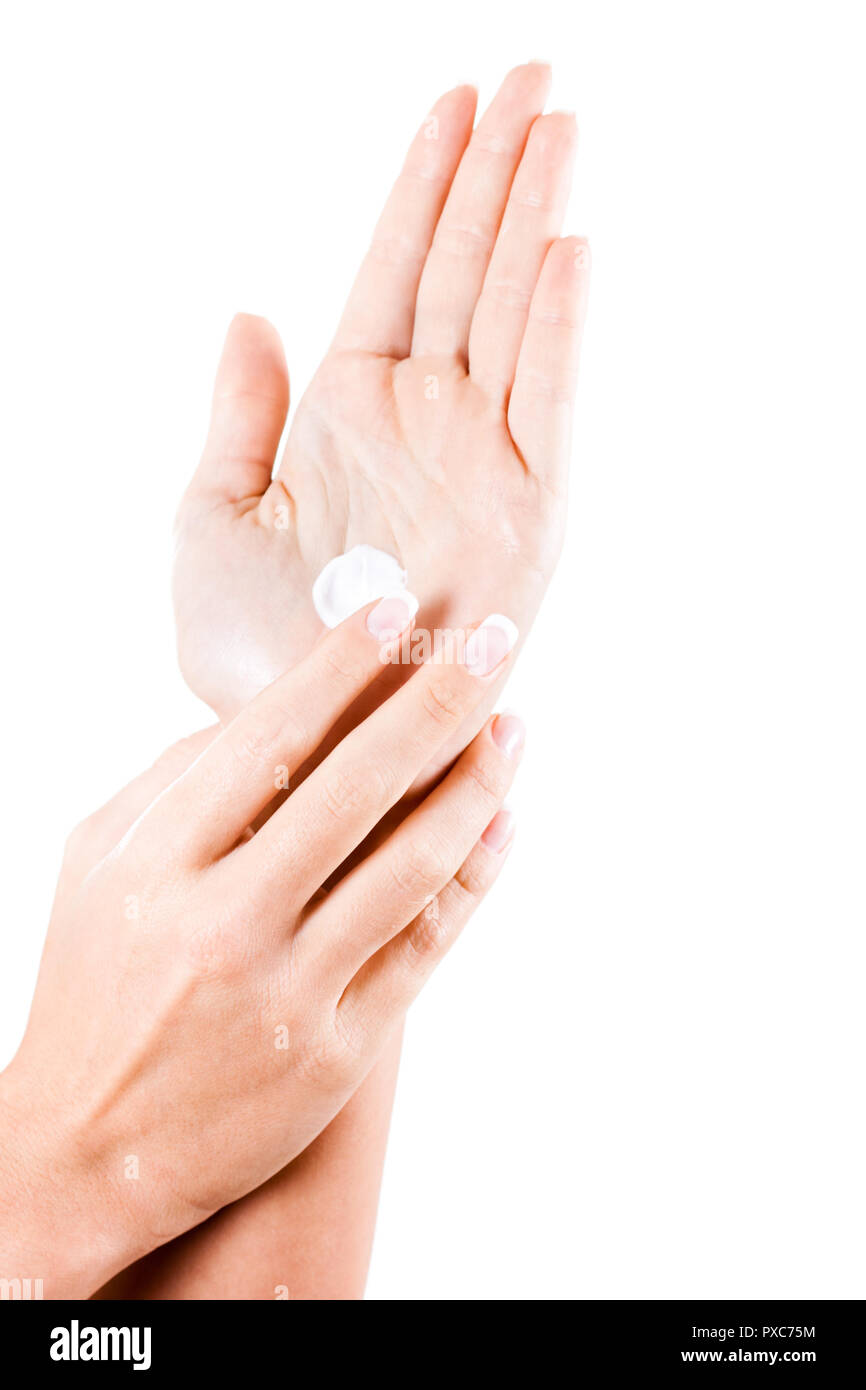 Applying moisturizer on hand Stock Photo - Alamy