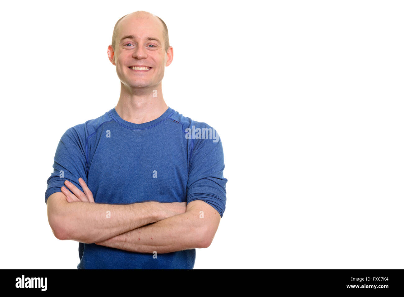 Happy bald Caucasian man smiling with arms crossed Stock Photo - Alamy