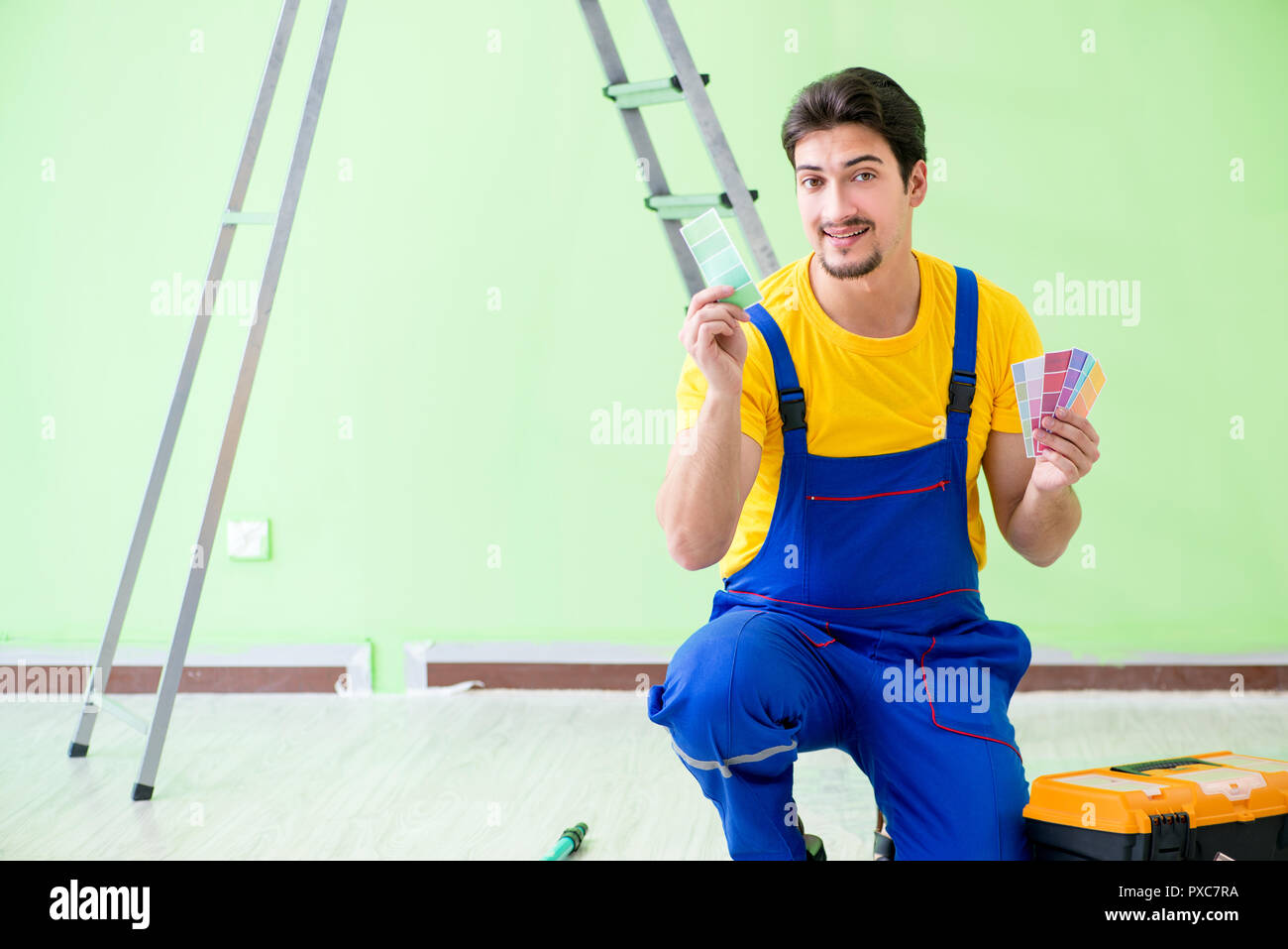 Young man doing home renovation Stock Photo - Alamy