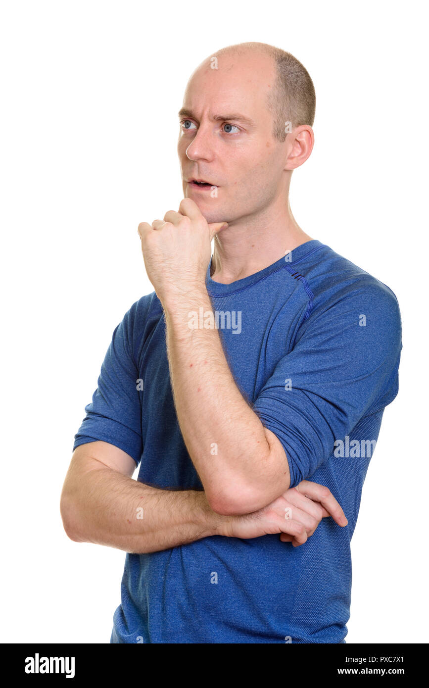 Bald Caucasian man thinking seriously and looking up Stock Photo - Alamy