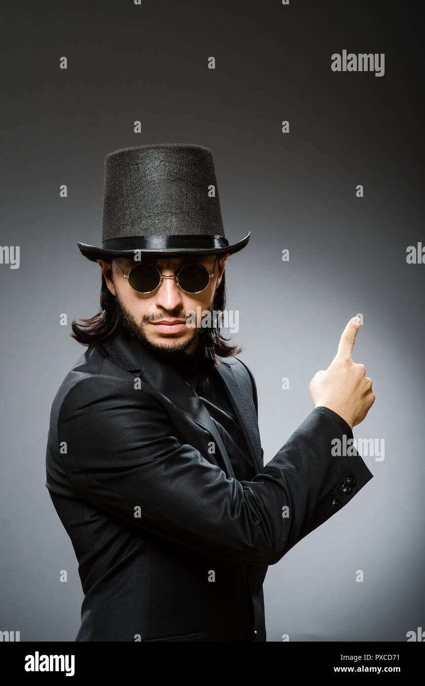 Vintage concept with man wearing black top hat Stock Photo - Alamy