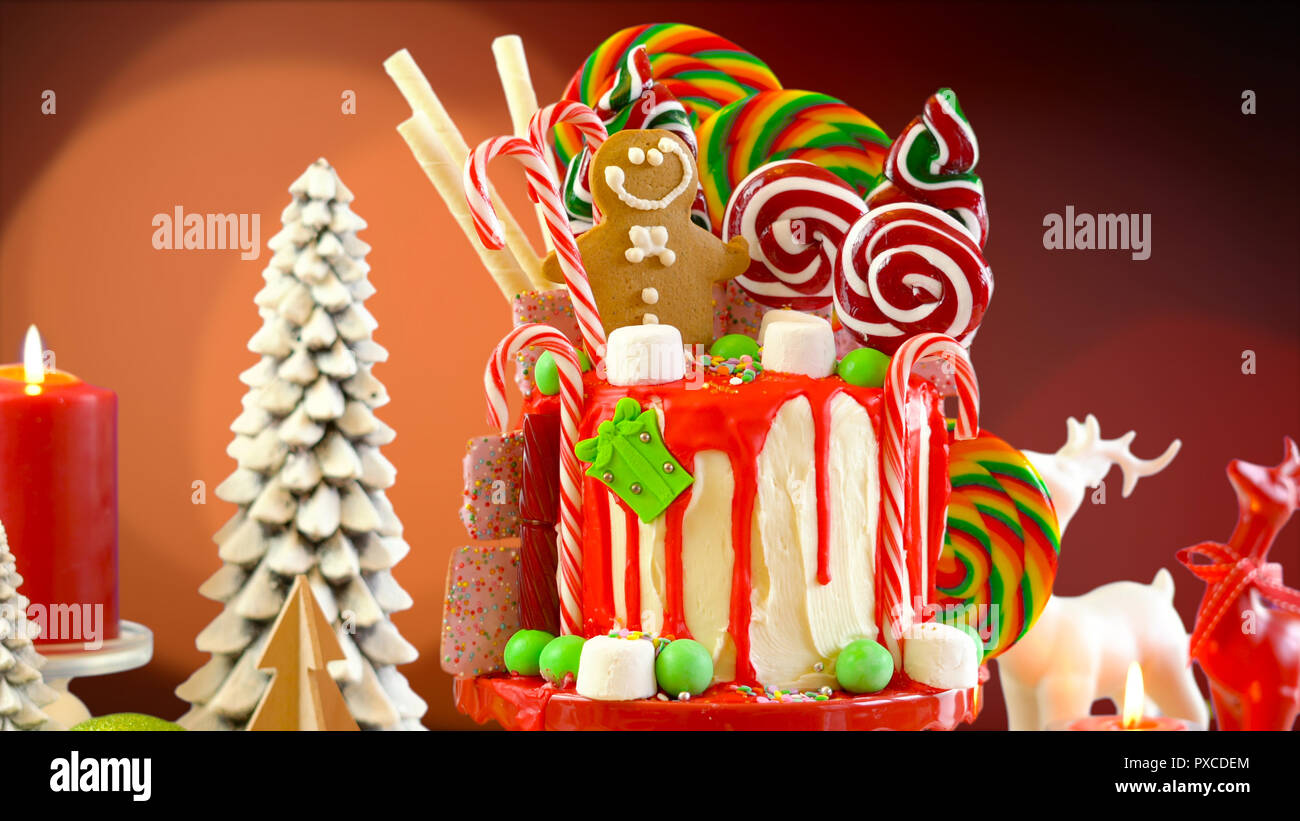On trend candyland Christmas drip cake with Christmas lights bokeh ...