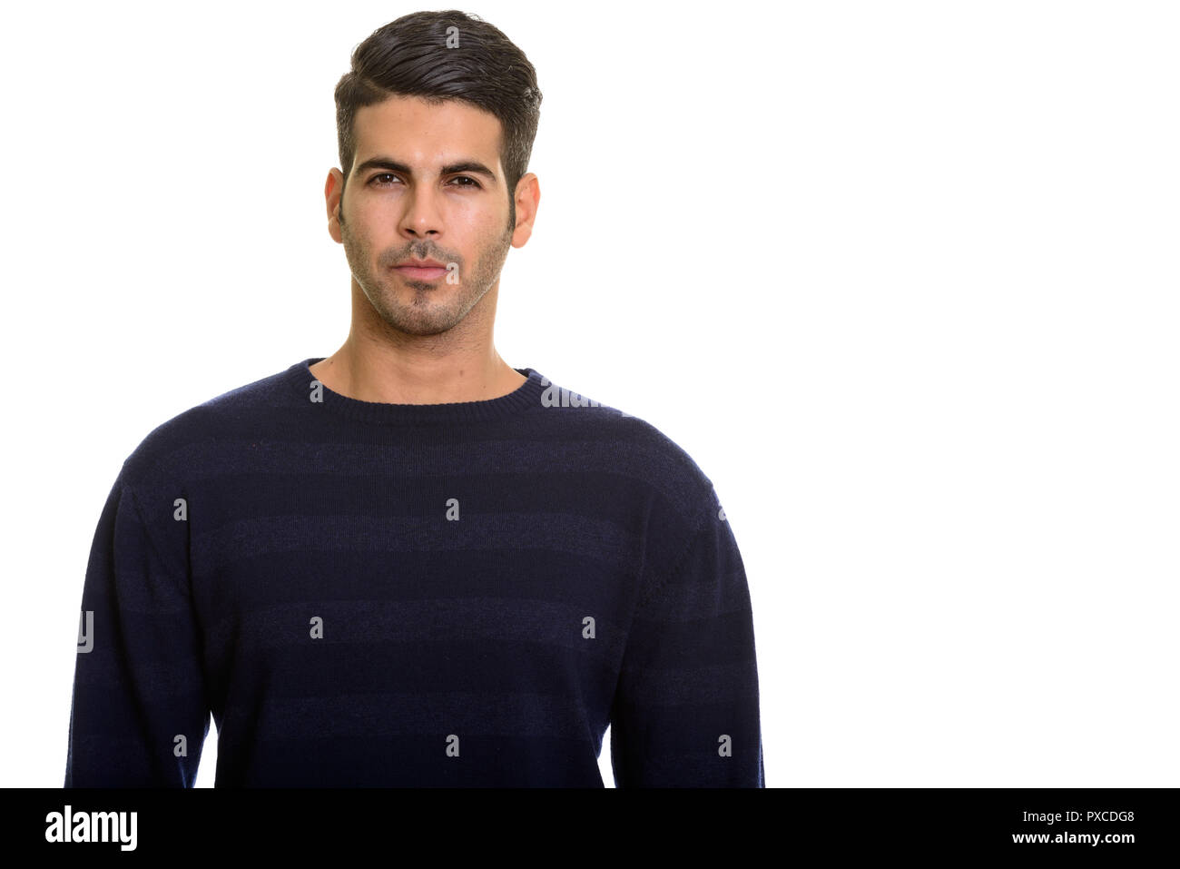 Studio portrait of young handsome Persian man standing Stock Photo - Alamy