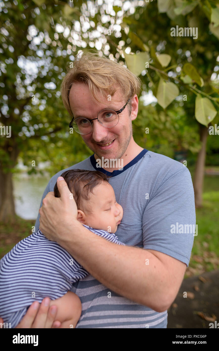 Father and baby son bonding together at the park Stock Photo - Alamy