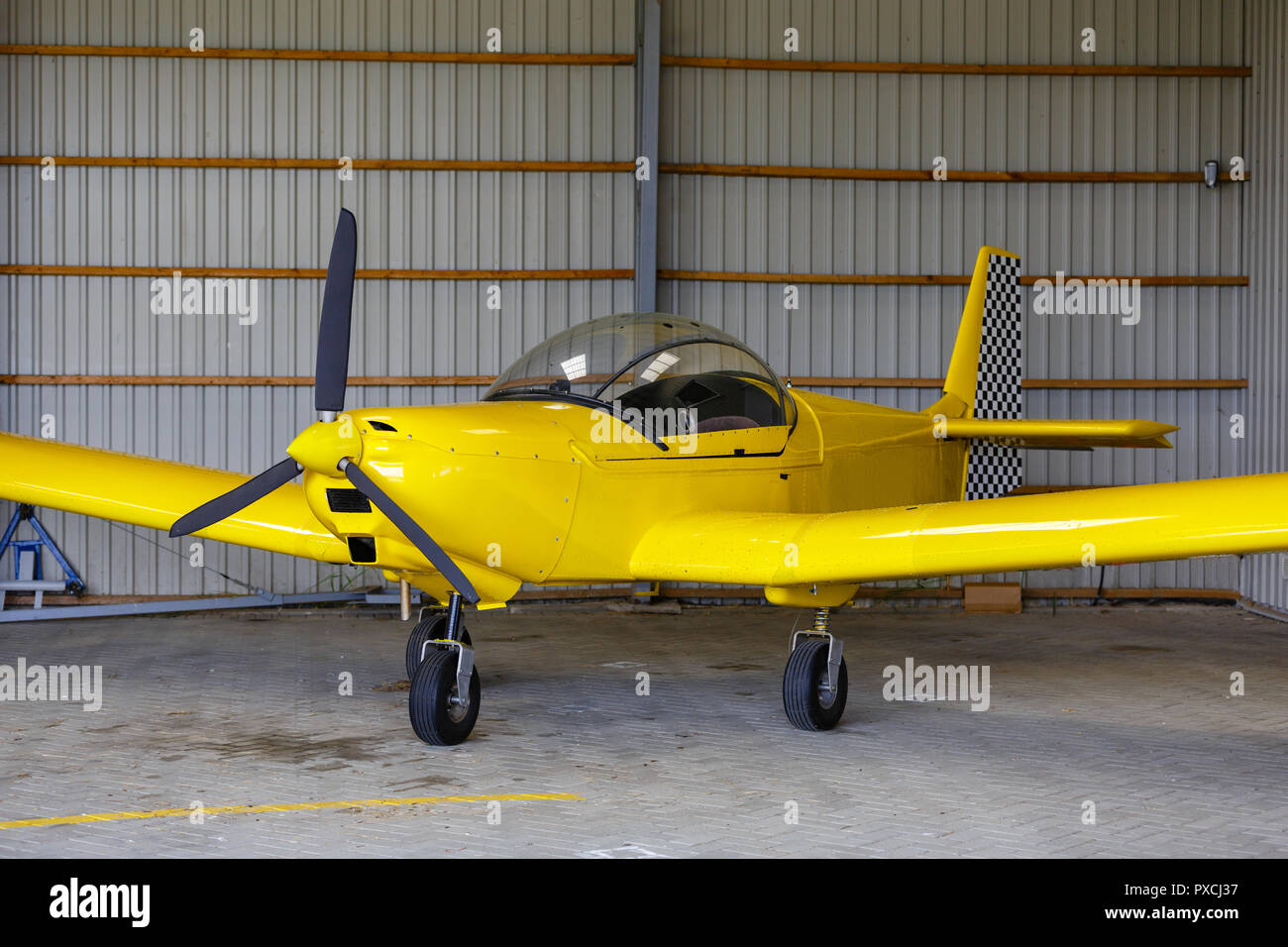 outdoor shot of small plane standing in shed Stock Photo - Alamy