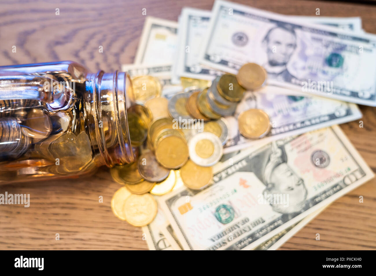 Bank notes with coins shwing spending money Stock Photo - Alamy